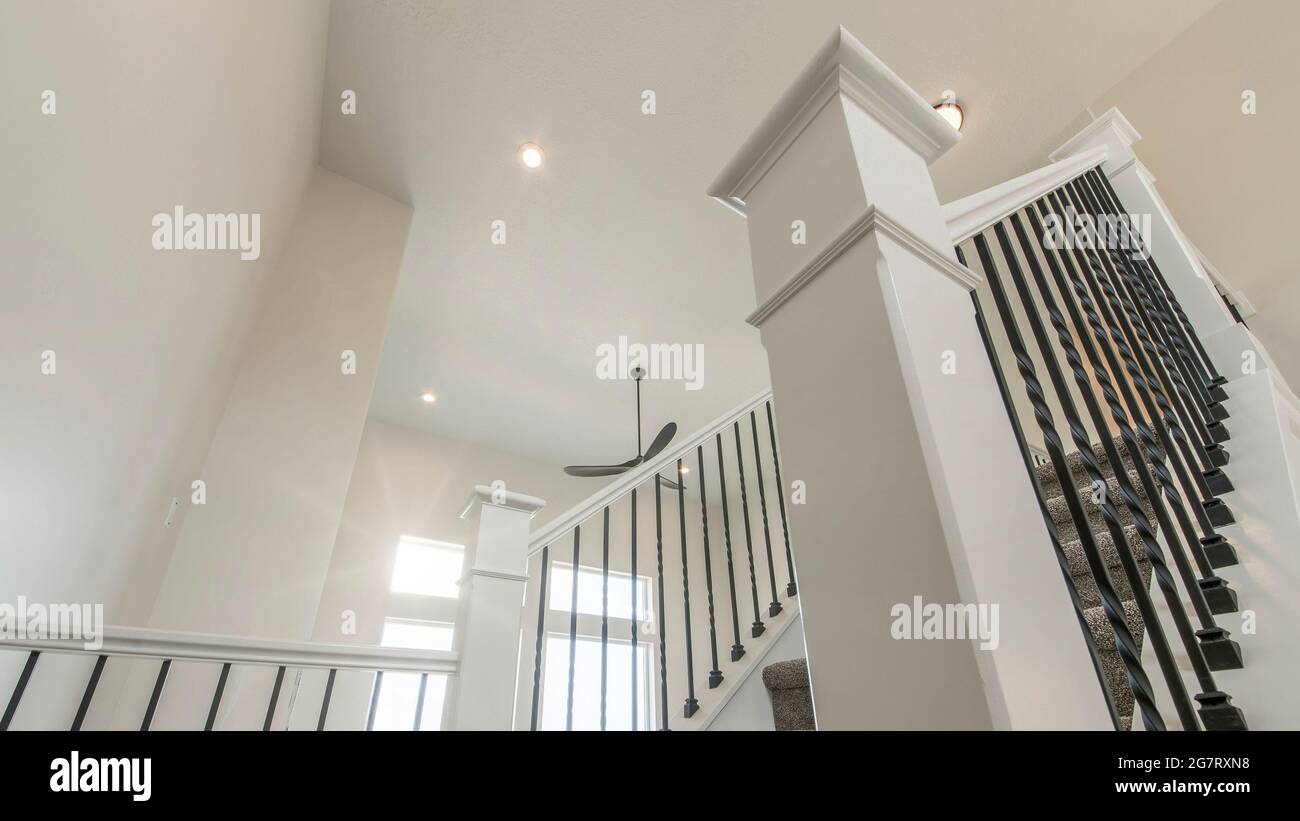Pano House interior with a view of a staircase and window Stock Photo ...
