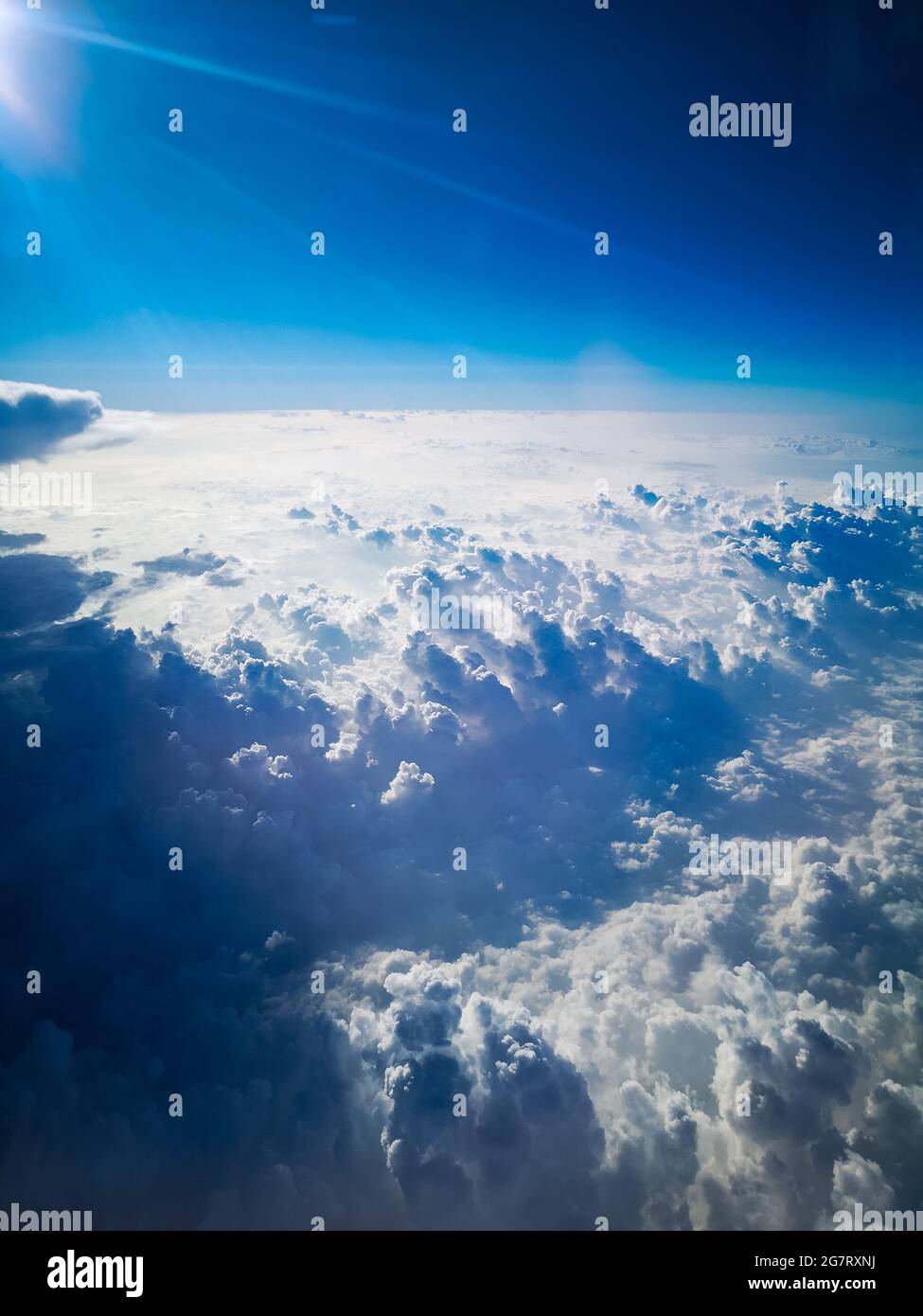 Aerial view from plane to morning sunrise over clouds Stock Photo - Alamy