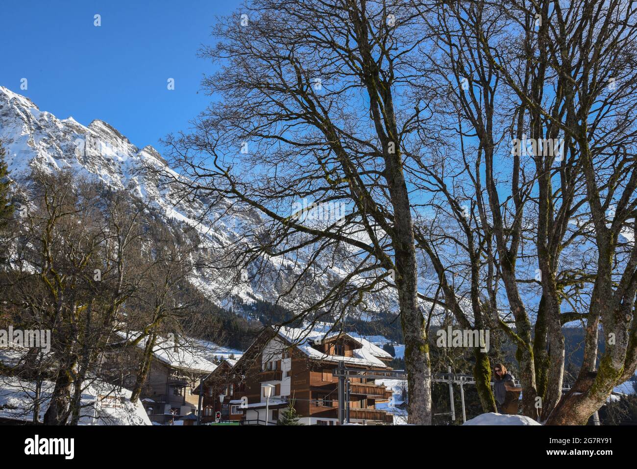 Small rural village surrounded by snow mountains hi-res stock ...