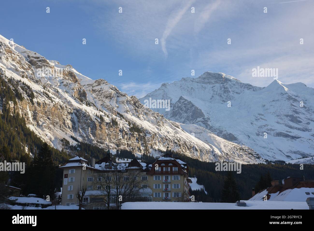 Small rural village surrounded by snow mountains hi-res stock ...