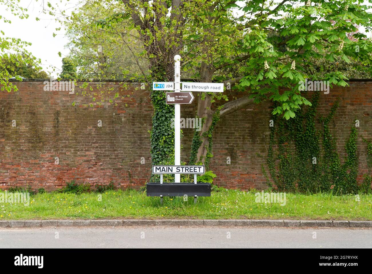 Old village sign post example Stock Photo - Alamy