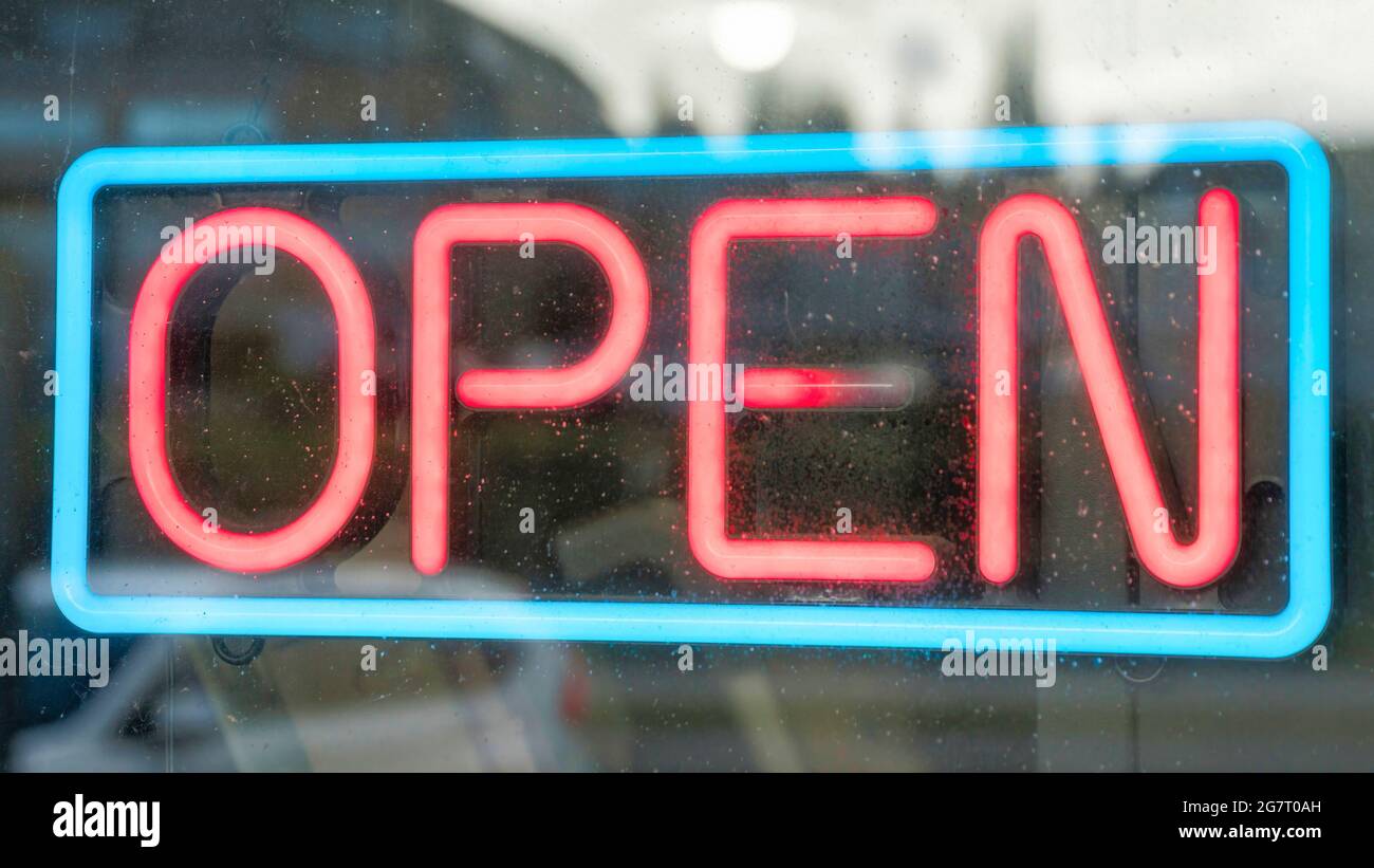 Pano Neon sign of open with red letters and the border as blue Stock ...