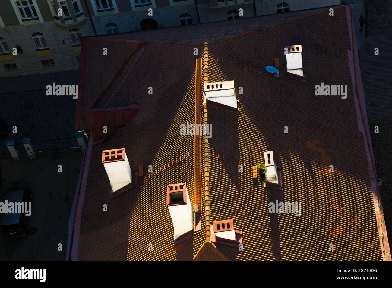 Bird's eye view of a roof of the residential building with many ...