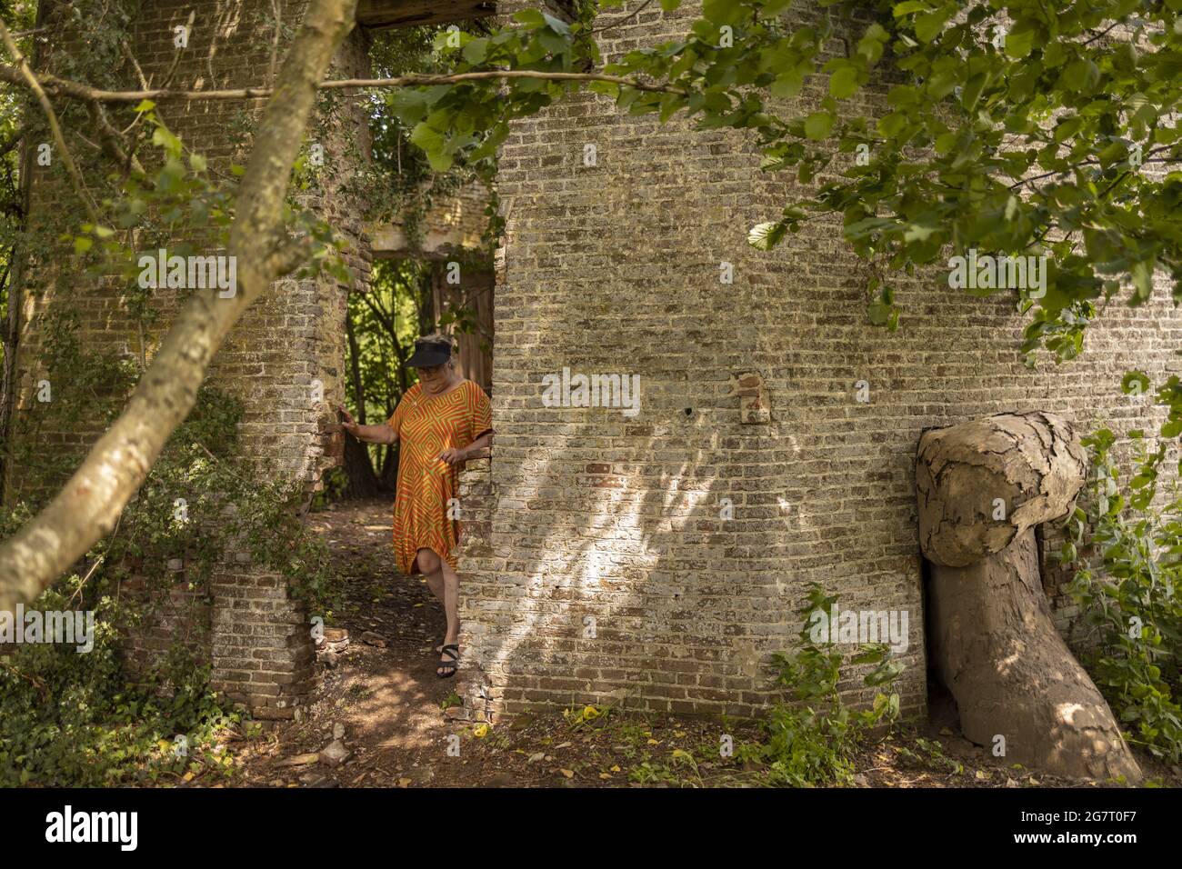 ZUTPHEN, NETHERLANDS - Jul 04, 2021: Woman walking around in stone ...