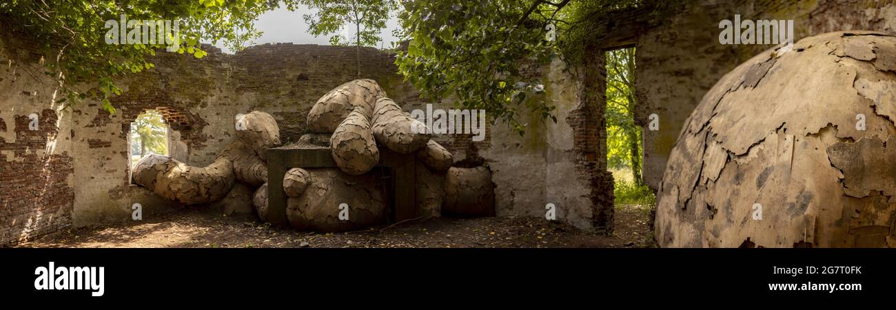 Remains of typical Dutch brick windmill overgrown with greenery Stock ...