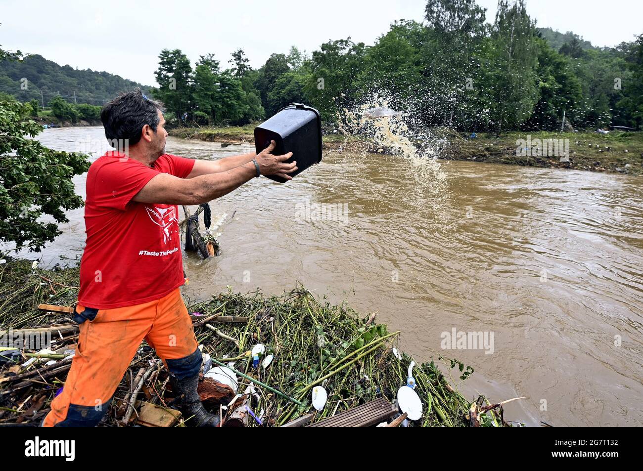 Illustration shows A man throwing back a fish in the river during ...
