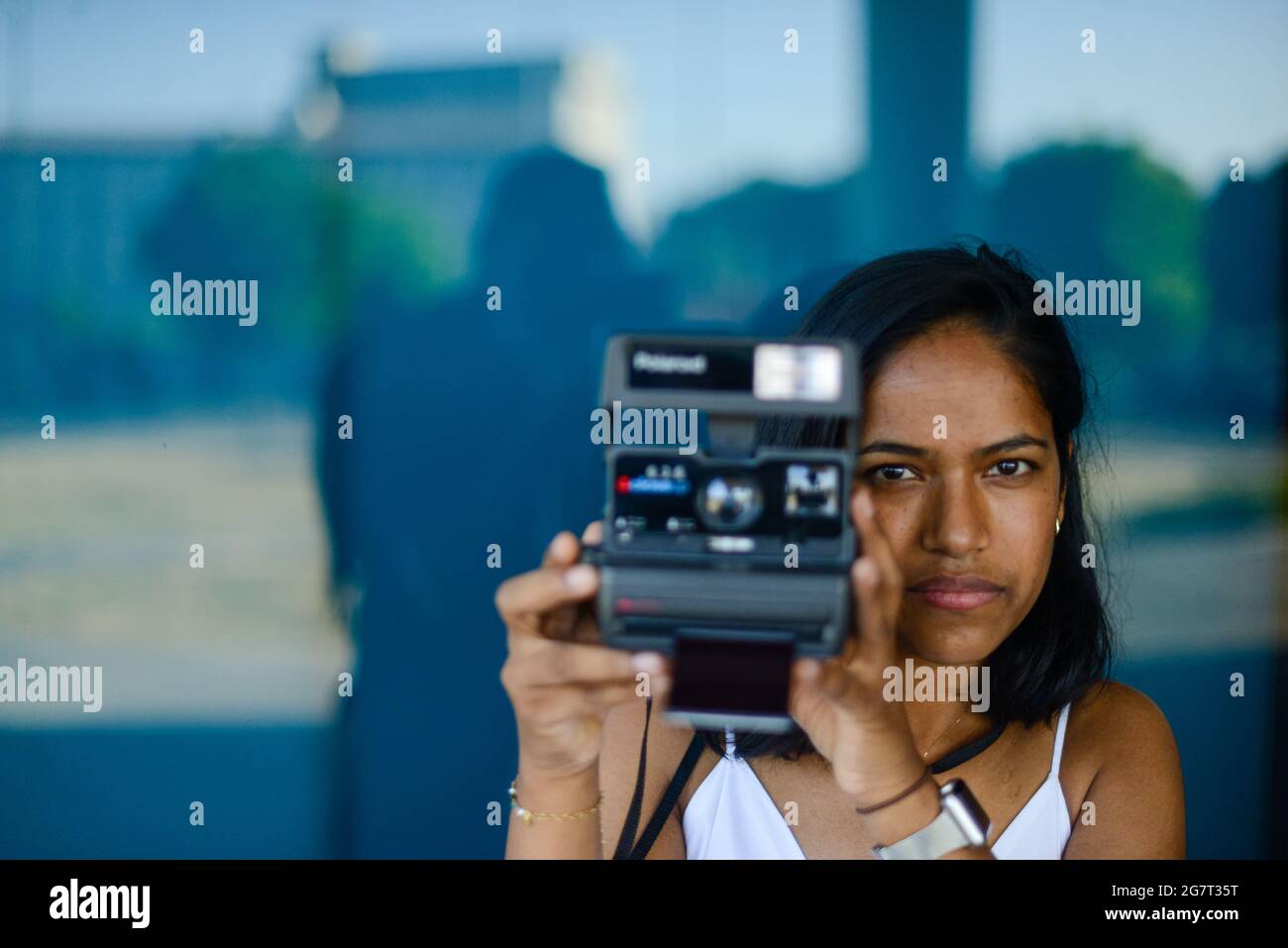 CREMONA, ITALY - Jun 15, 2015: An East Asian female using a vintage ...