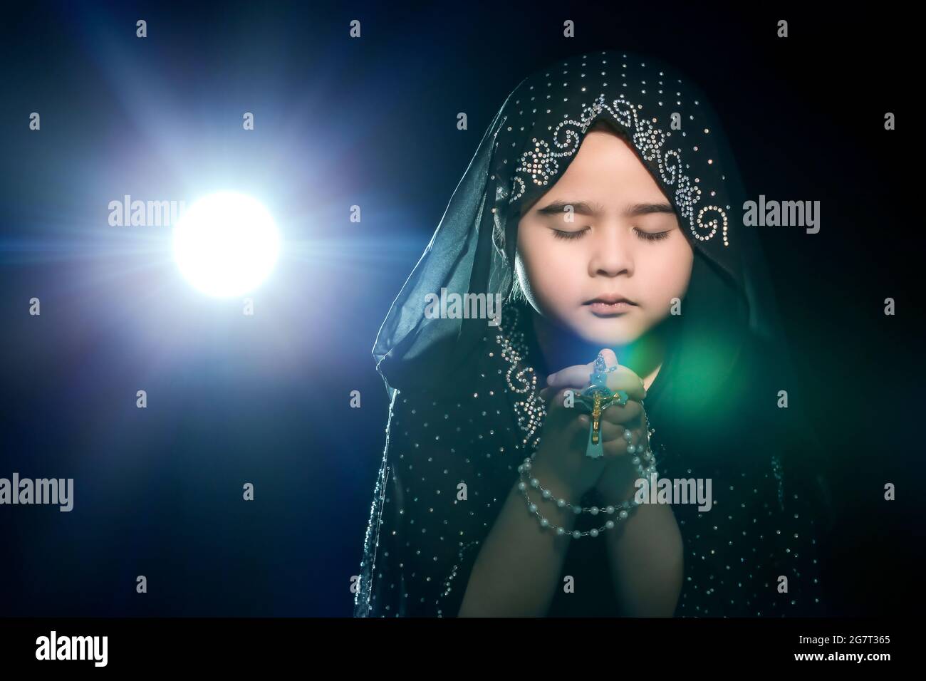 Baby girl praying hi-res stock photography and images - Alamy