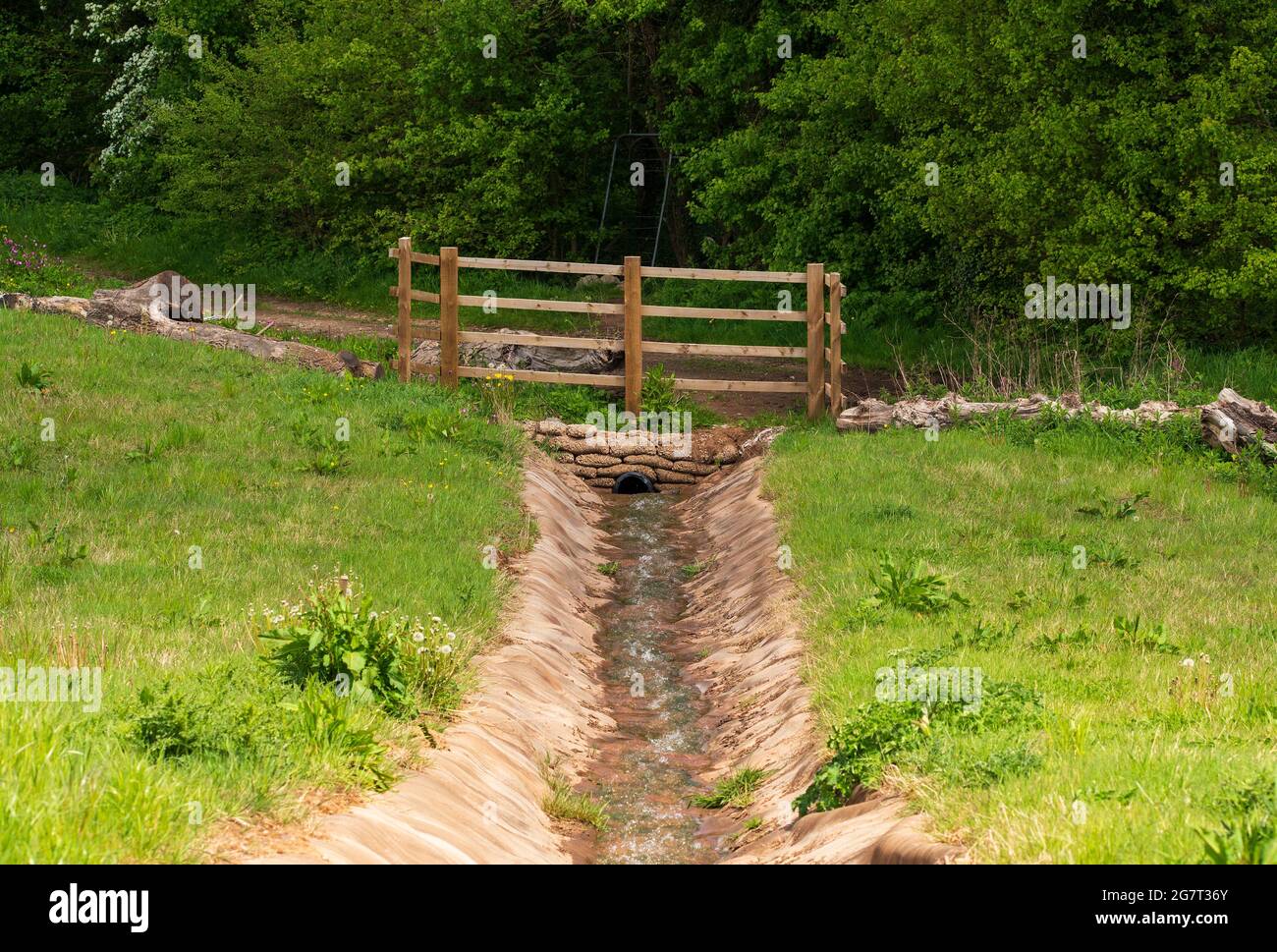 Artificial field drainage channel Stock Photo - Alamy