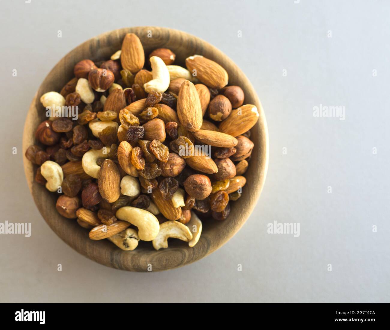 Photo of a different types of nuts in a plate on a gray table Stock ...