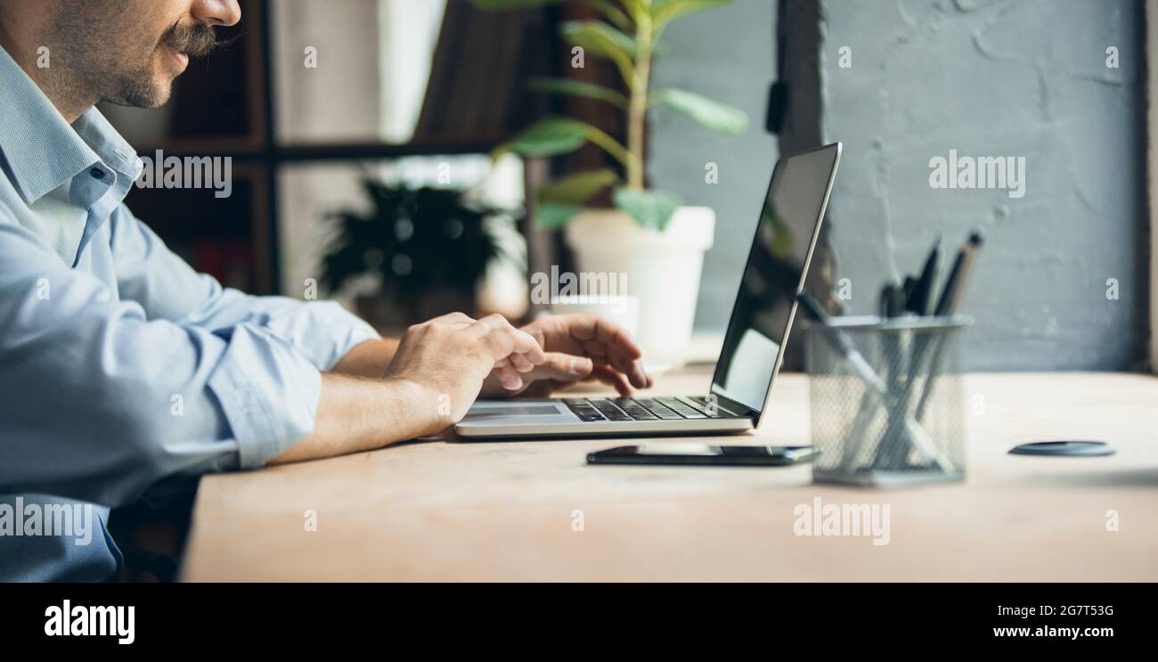 Flyer with image of one young businessman, manager working on laptop ...