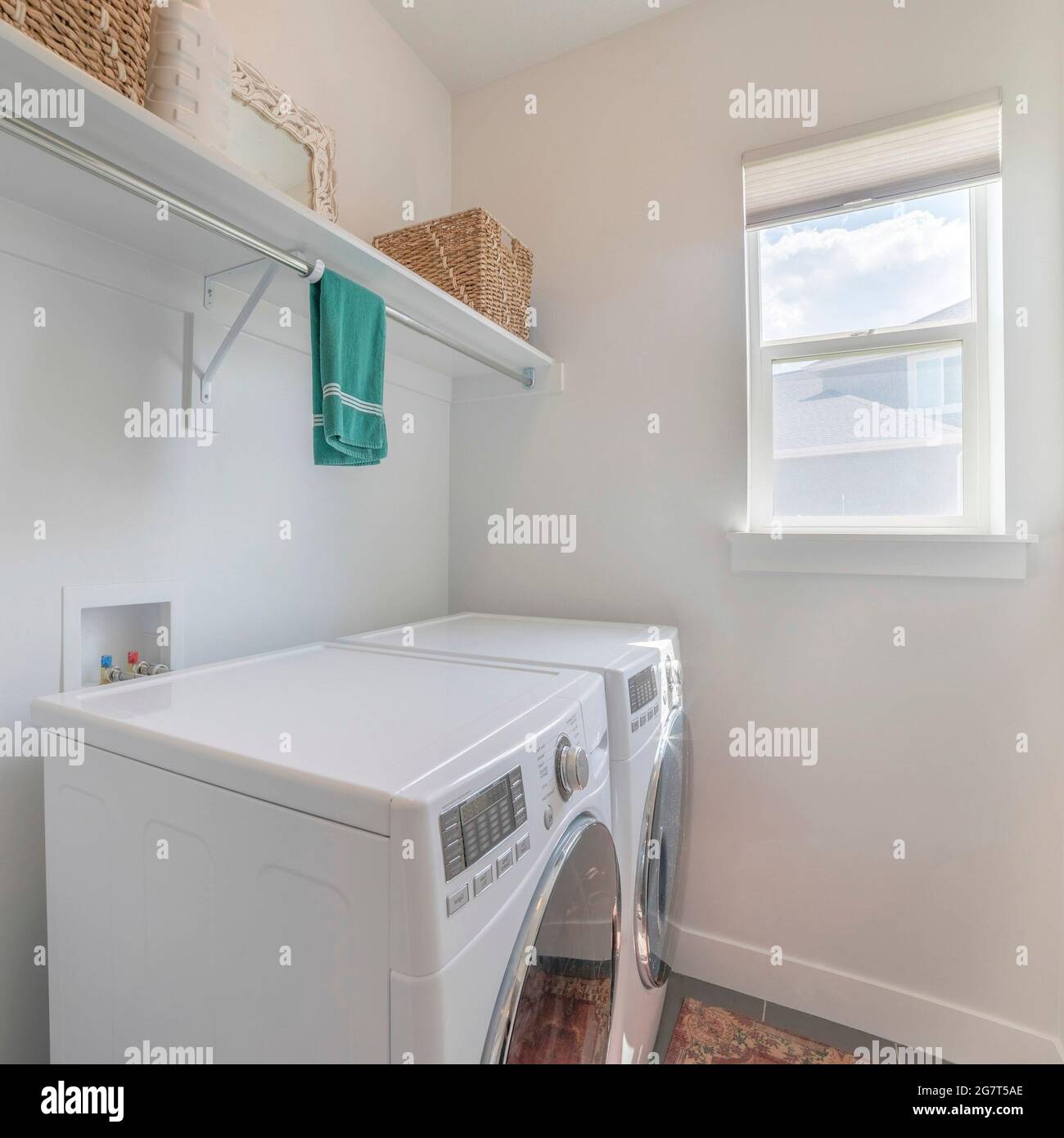 Square frame Clean laundry room with one window and two laundry ...