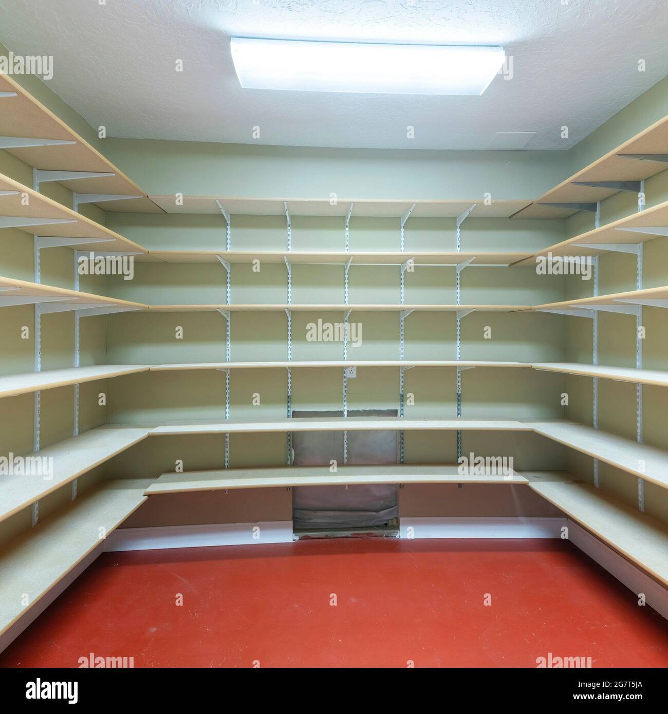 Square frame Interior of a food storage room with empty shelves at the ...