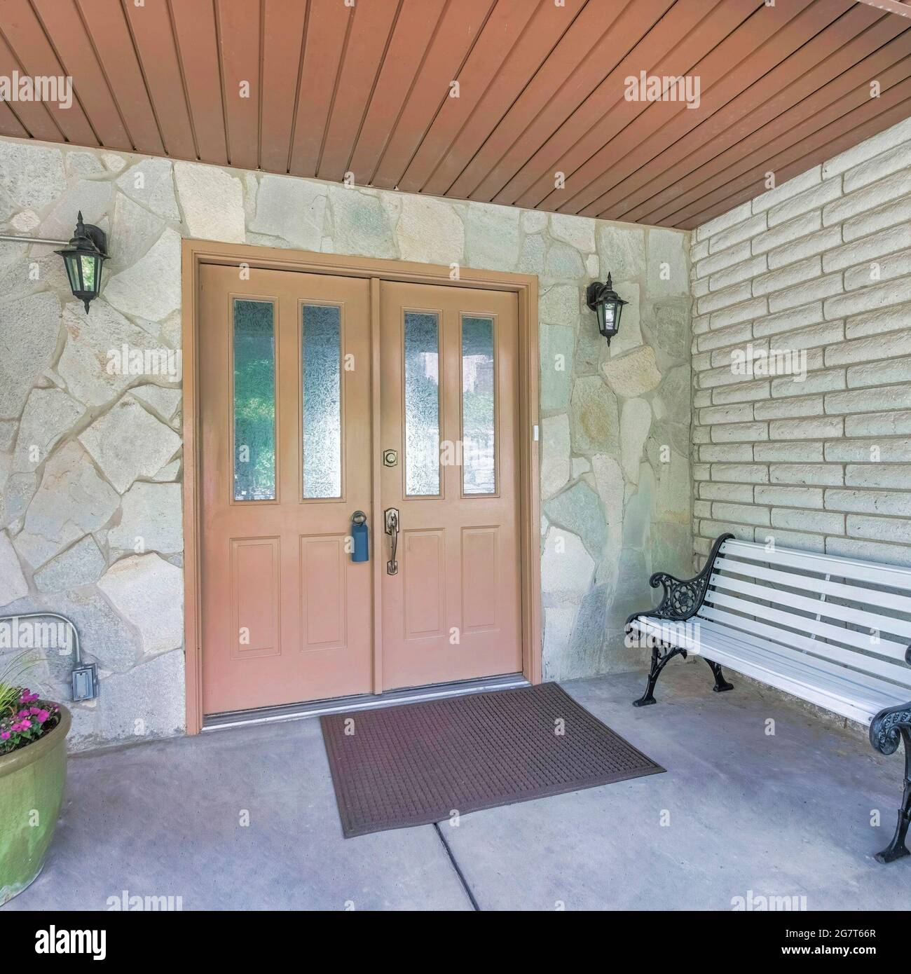 Square frame Glass paned double front door of house with modern lockbox ...