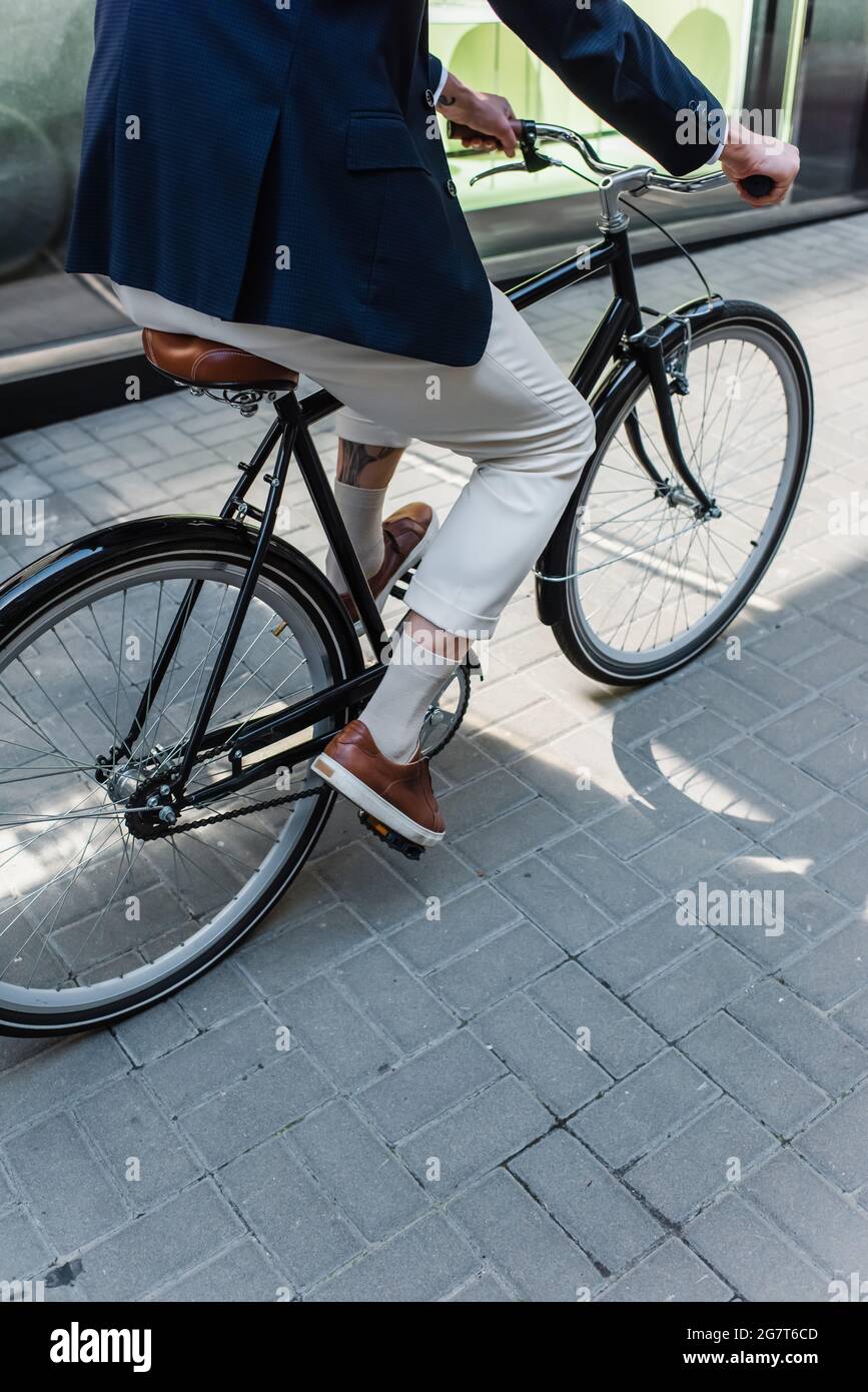 partial view of man riding bicycle outside Stock Photo - Alamy