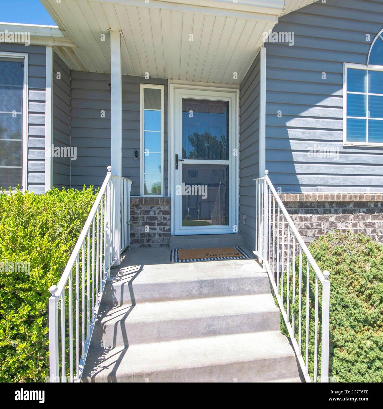 Square frame Exterior of a house with bricks and vinyl sidings and ...