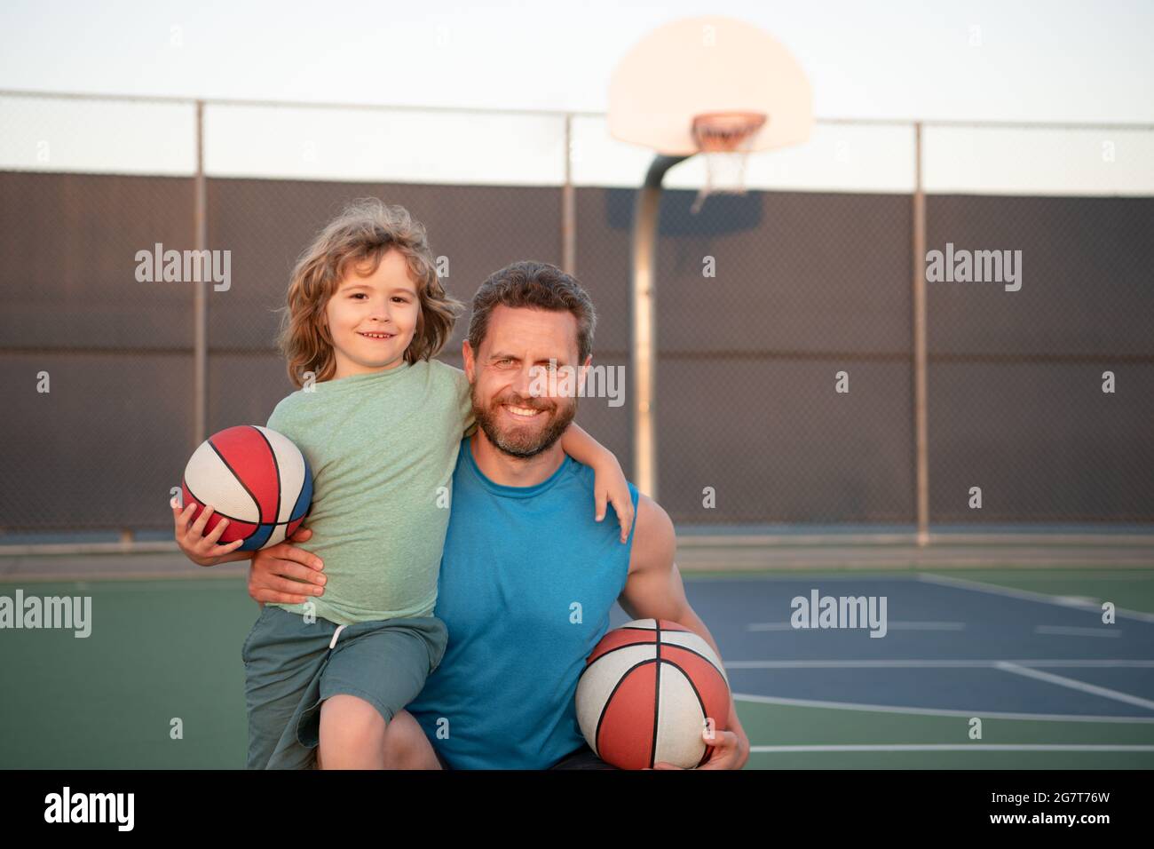 Father and son playing basketball. Family leisure activities concept ...