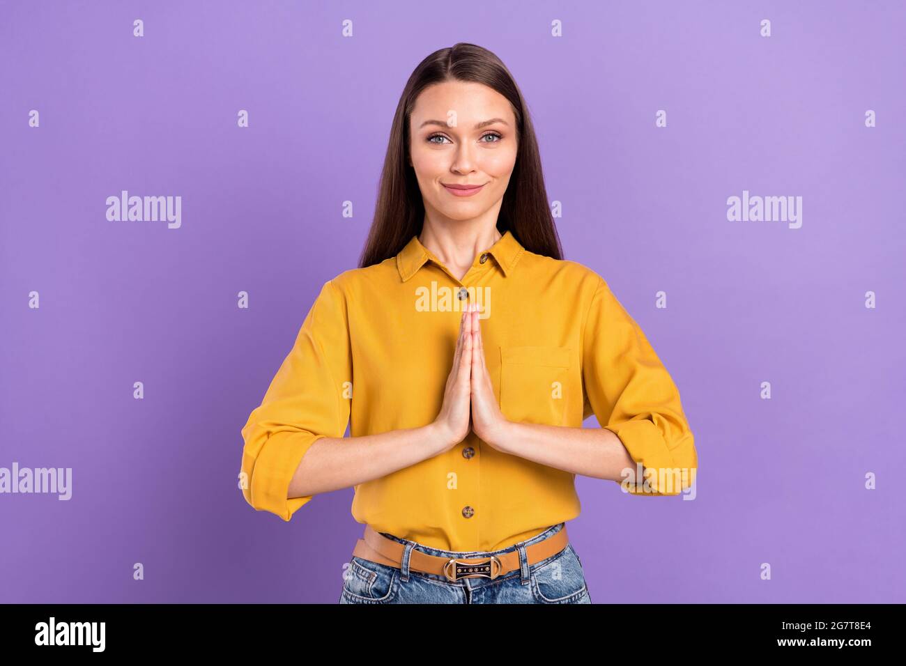 Photo of cute millennial lady hold hands wear yellow shirt isolated on ...