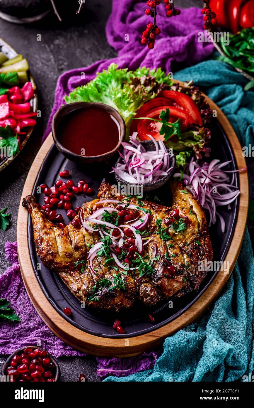 Chicken Tabaka.traditional Georgian dish ..style rustic.selective focus ...