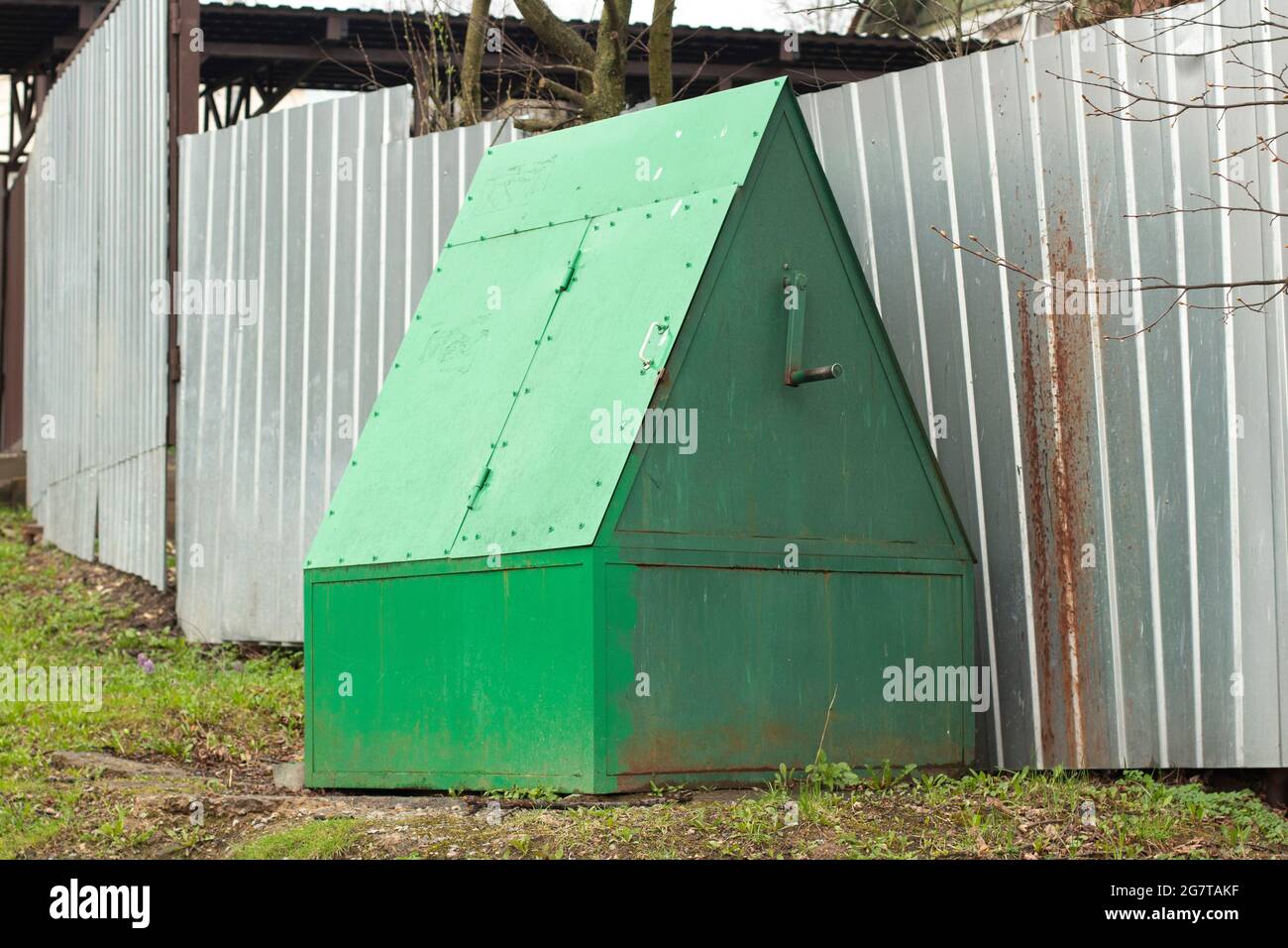 Well in the yard. Fresh water source. A device for raising water from a ...