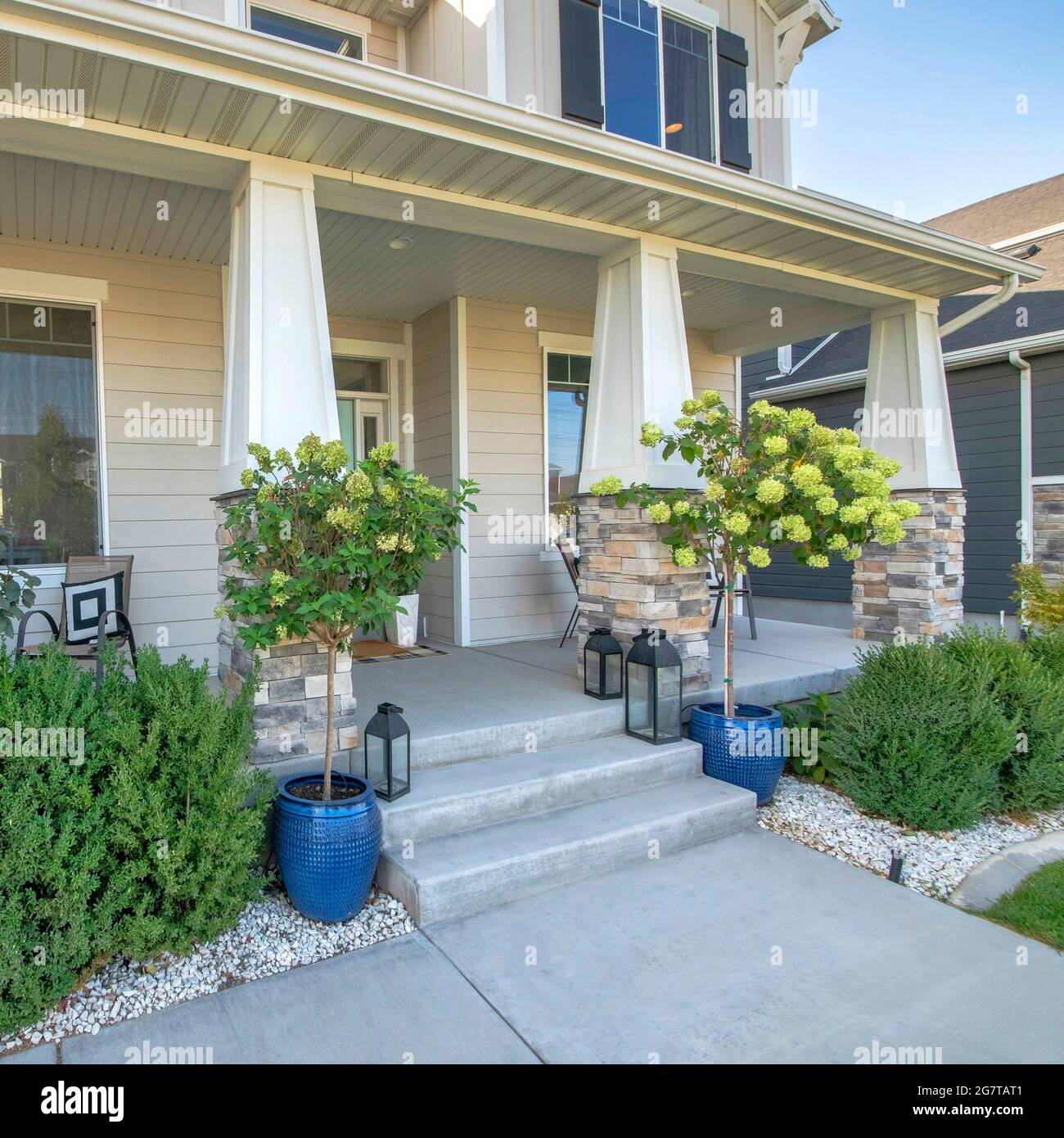 Square frame House exterior with bricks, garage and front yard ...