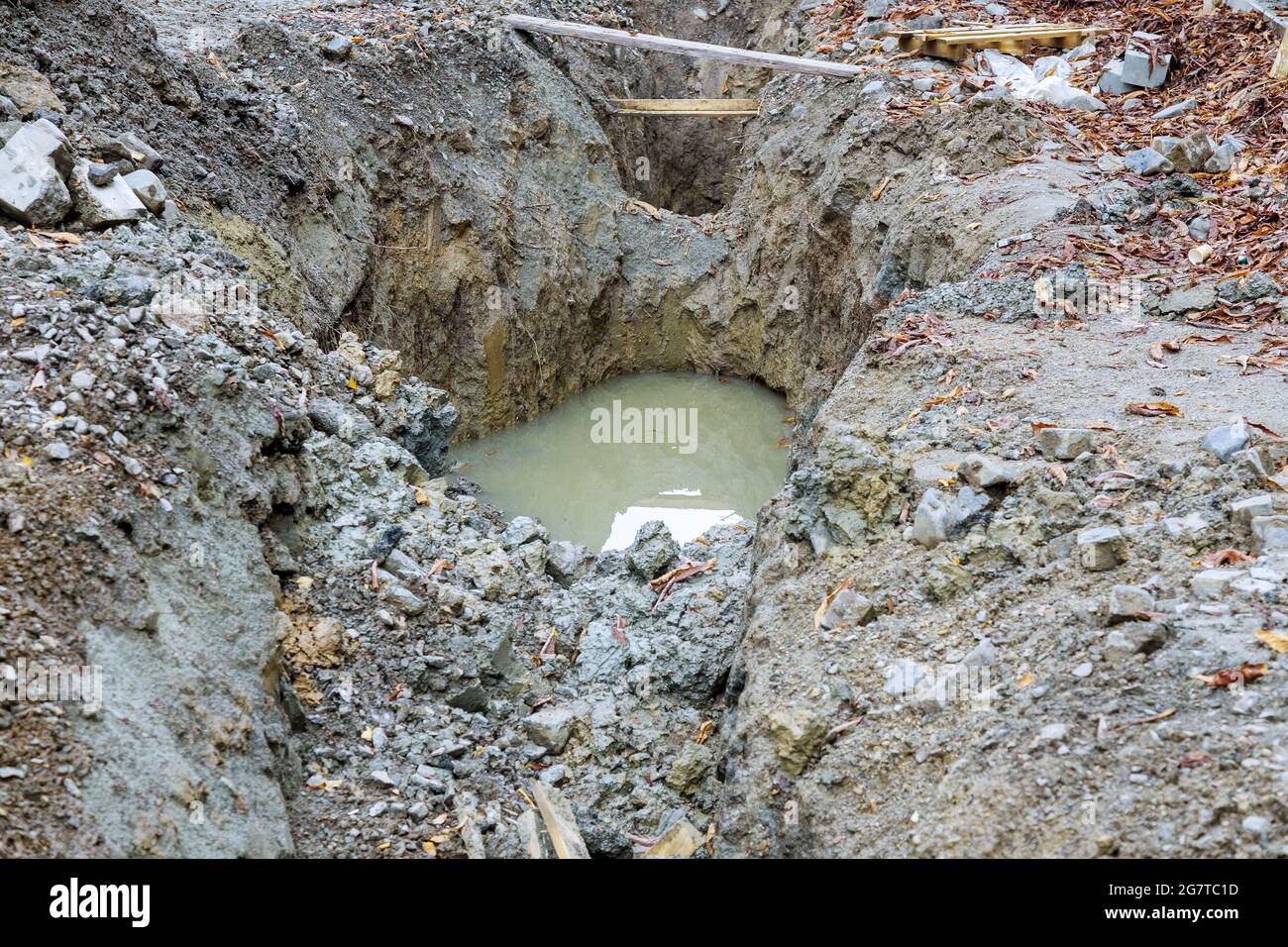 Repair works of digging road to change sewer pipes on the construction ...