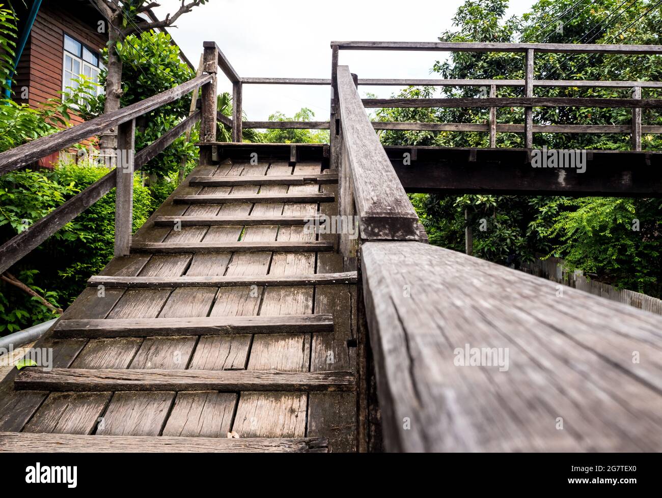 wooden bridge across the drainage canal Stock Photo - Alamy