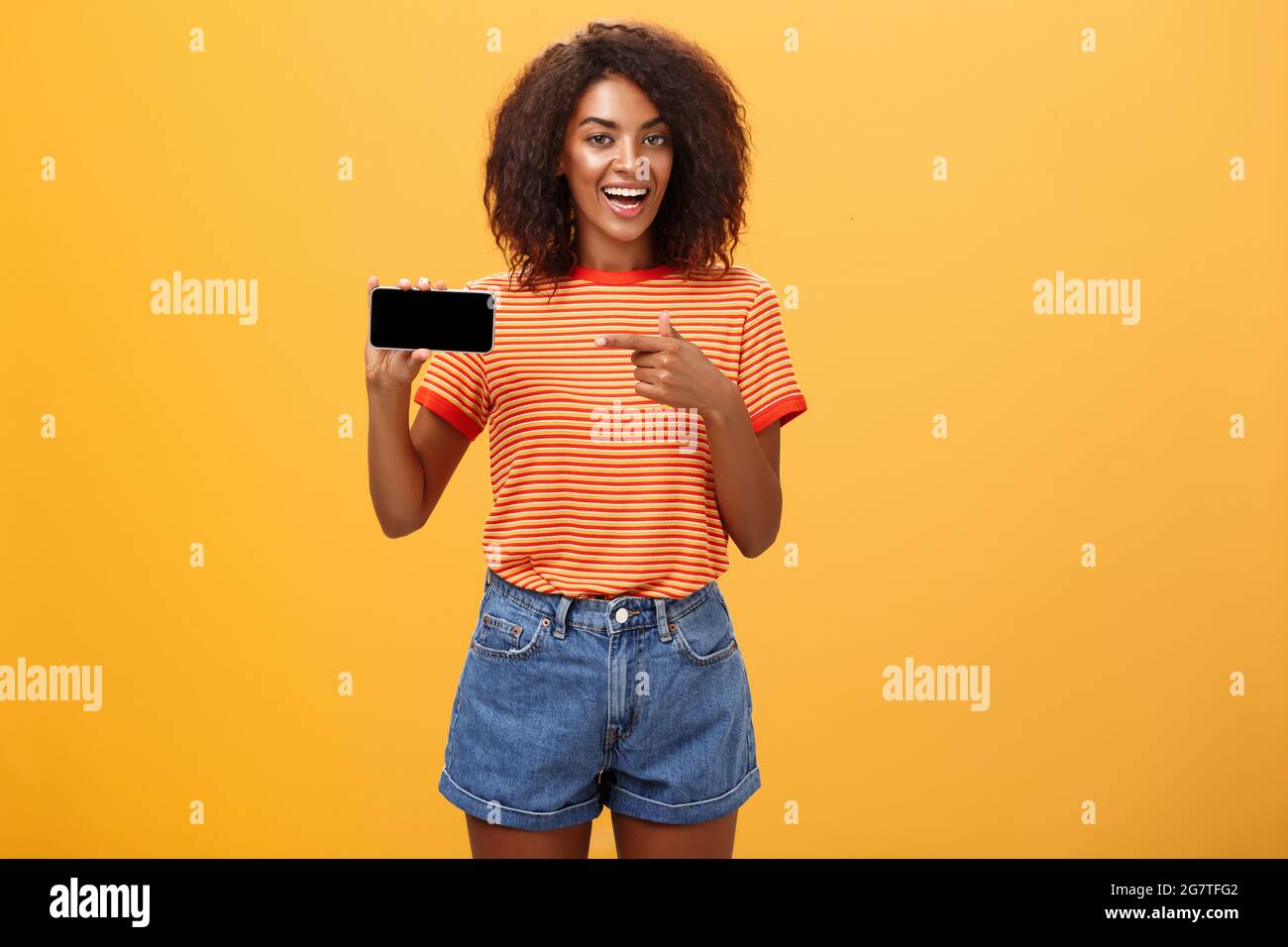 Girl showing picture in phone bragging about her cool vacation ...