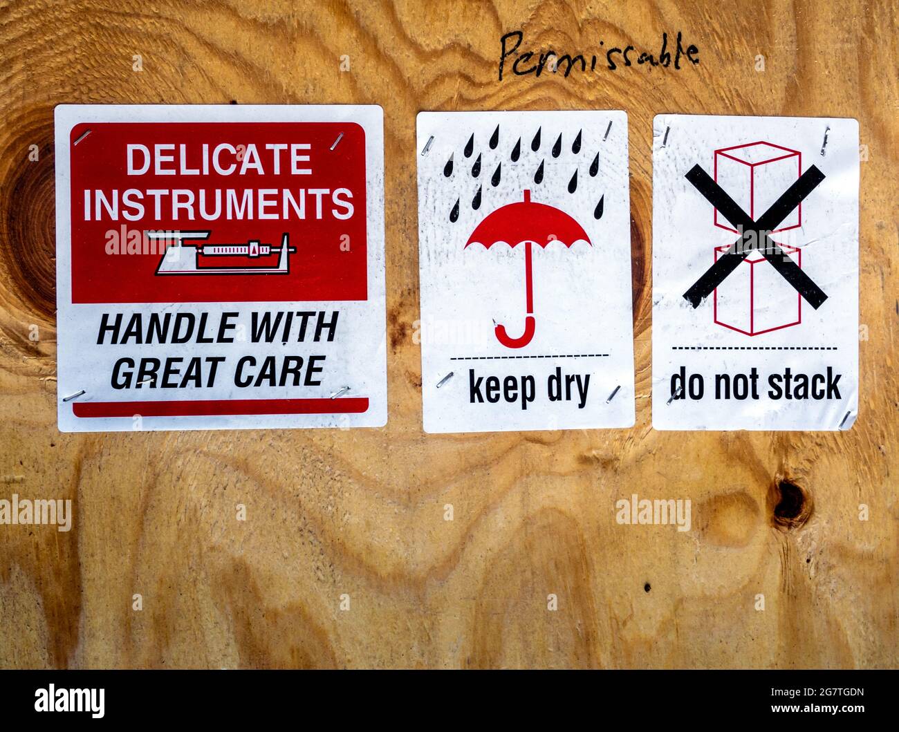 warning label beside transportation wooden box Stock Photo - Alamy