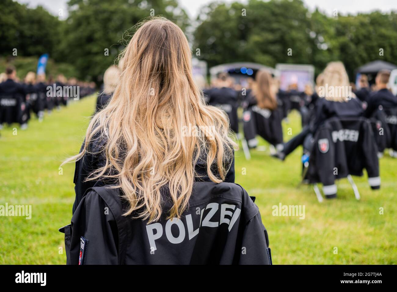 Oldenburg, Germany. 16th July, 2021. A female police officer of the 9th ...