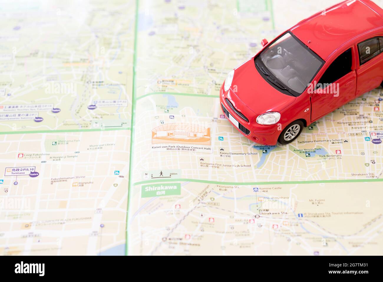 Toy car on a road map Stock Photo - Alamy
