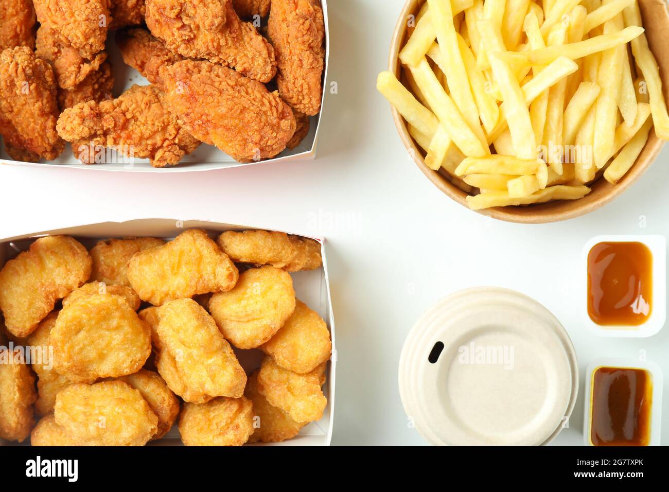 Concept of fast food on white background Stock Photo - Alamy