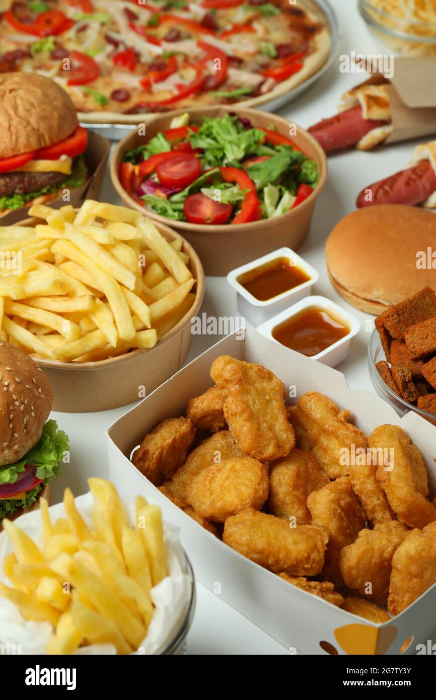 Concept of fast food on white background Stock Photo - Alamy