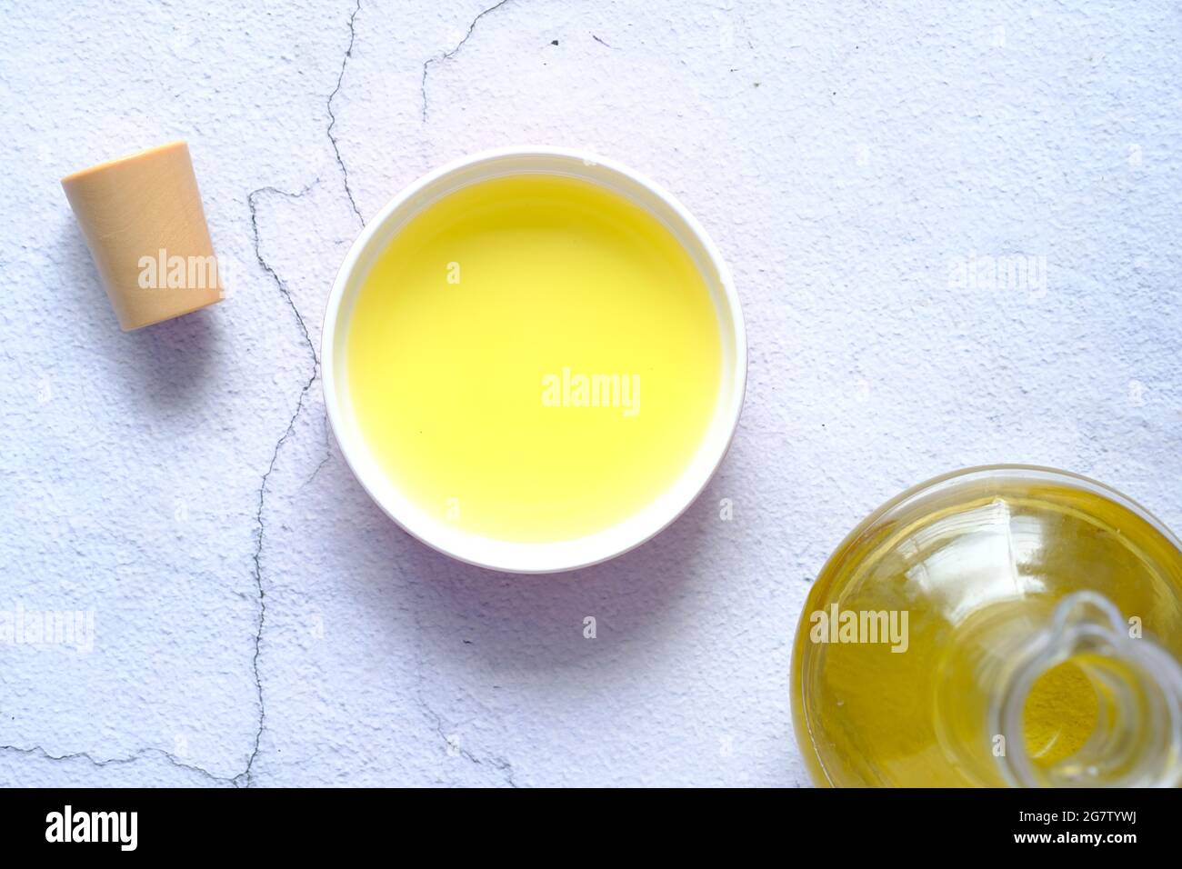 olive oil in a small container on table , top view Stock Photo - Alamy