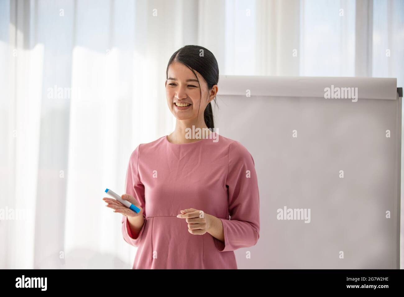 Smiling millennial female coach or presenter talk interact with ...