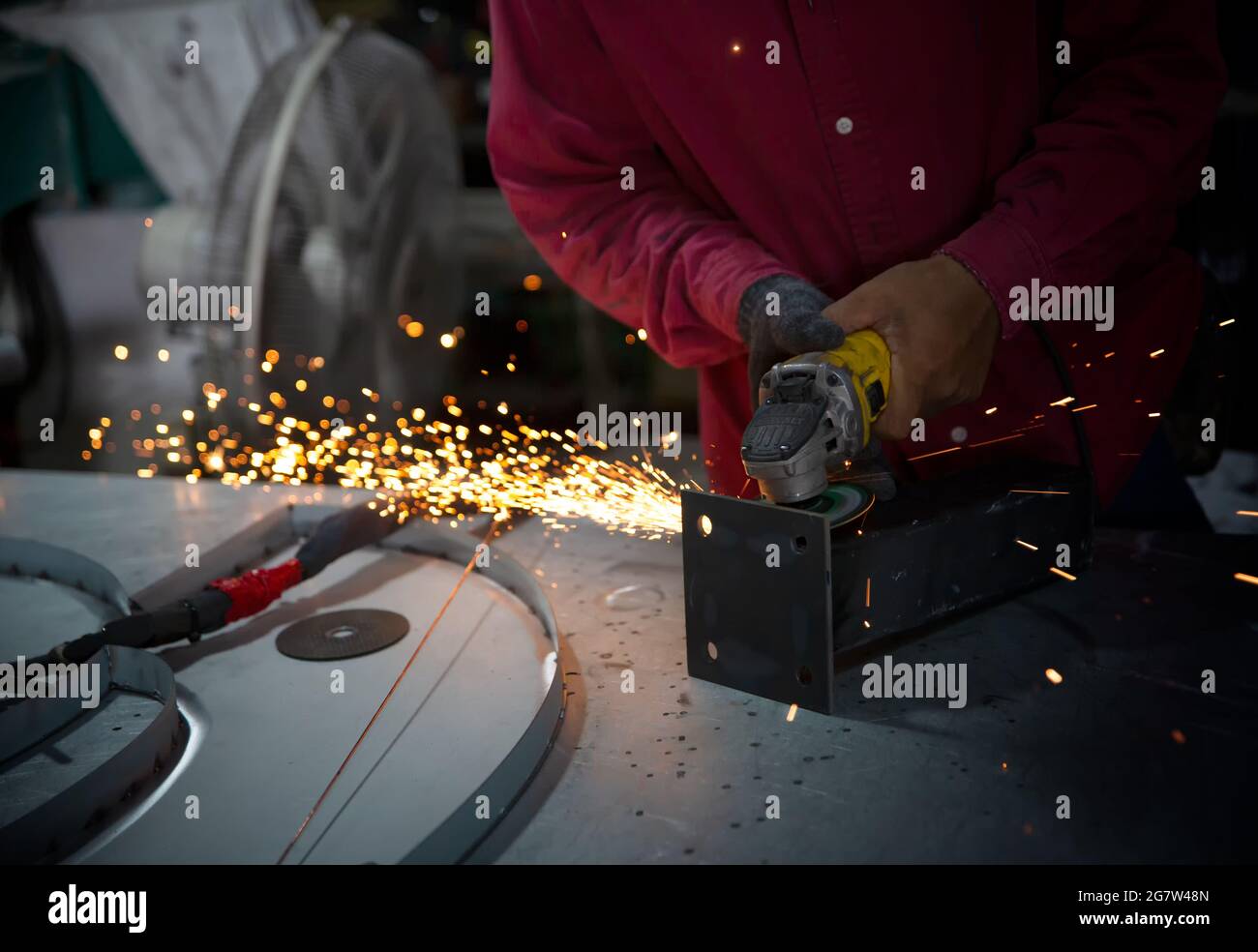 Welder used grinding stone on steel in factory with sparks, Welding ...