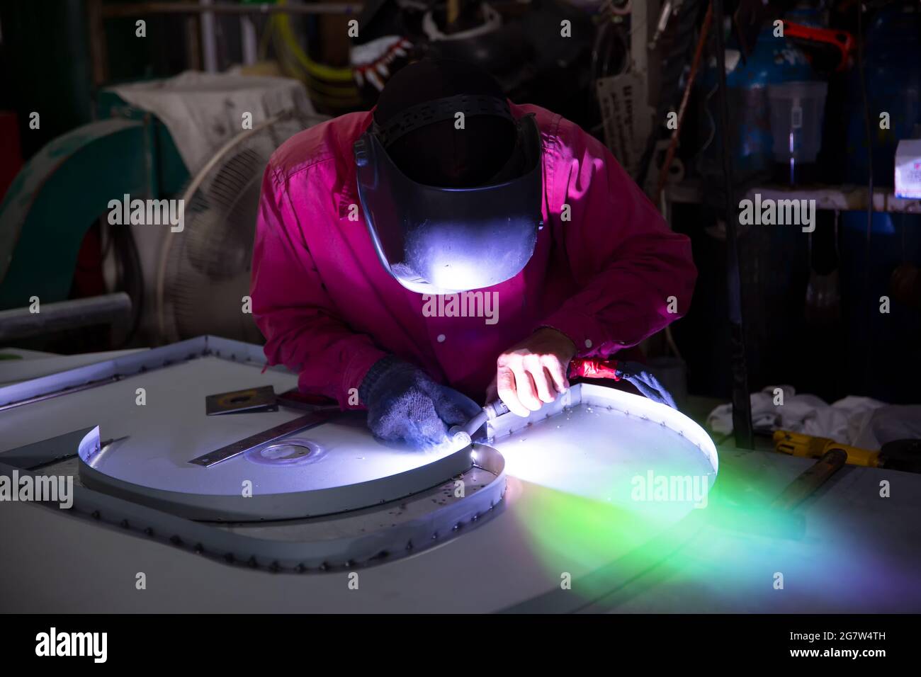 Welder used grinding stone on steel in factory with sparks, Welding ...