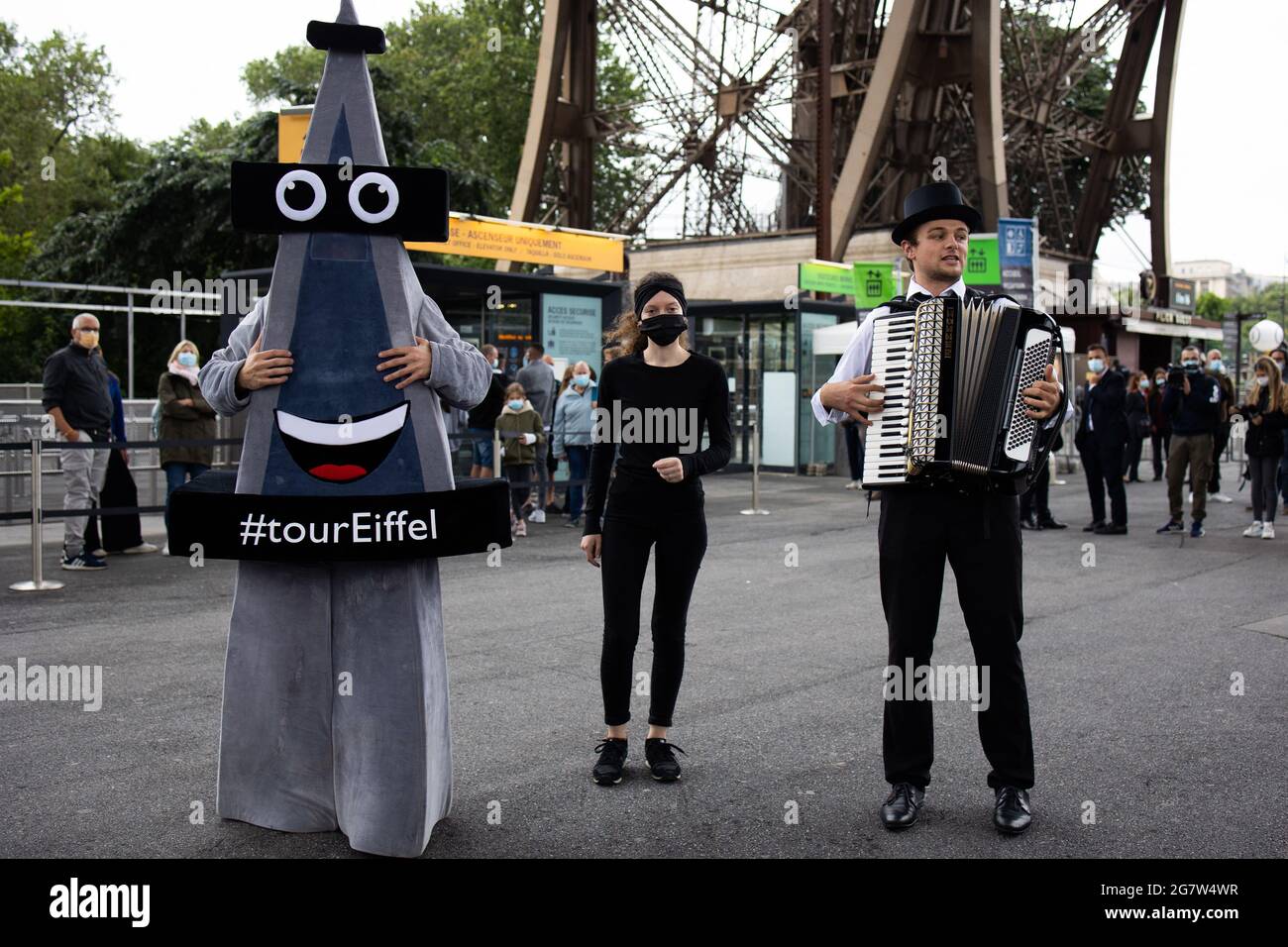 Paris, France. 16th July, 2021: An employee wears a Eiffel Tower ...