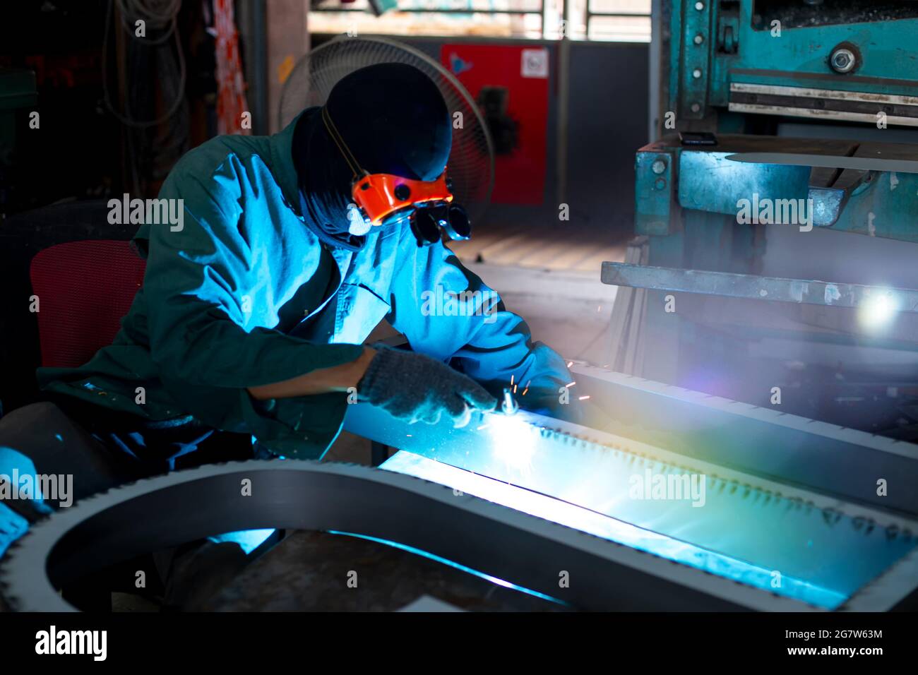 Welder used grinding stone on steel in factory with sparks, Welding ...