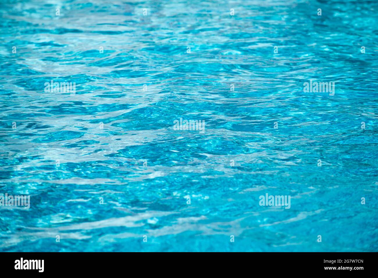 Abstract ripple wave and clear turquoise water surface in swimming pool ...