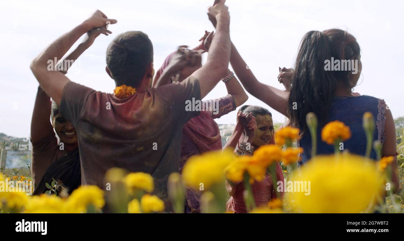 Group of people having fun during the Holi Hindu festival of Color in ...