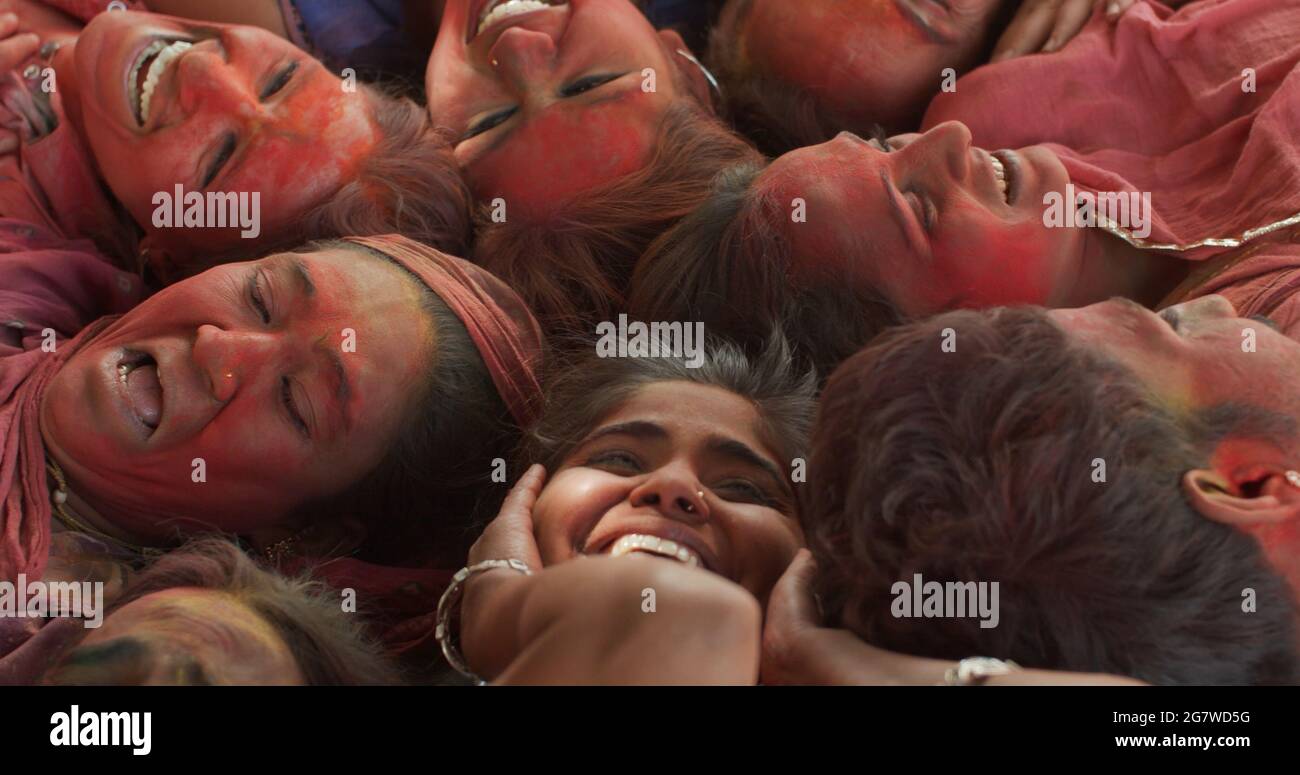 Group of people having fun during the Holi Hindu festival of Color in ...