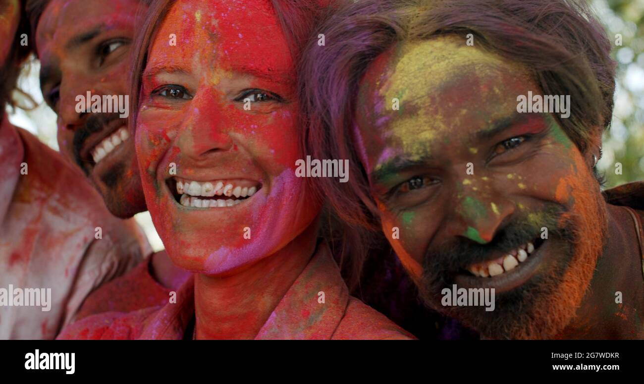 Group of people having fun during the Holi Hindu festival of Color in ...