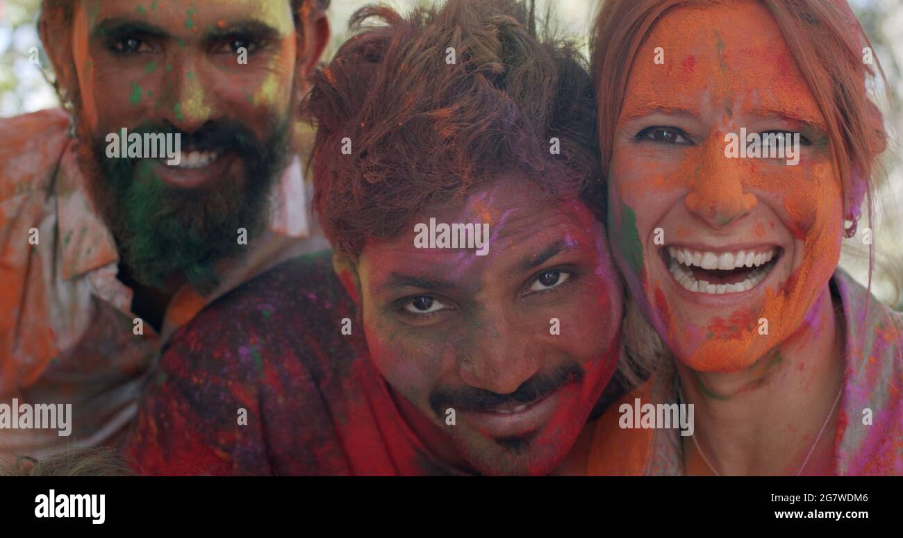 Group of people having fun during the Holi Hindu festival of Color in ...