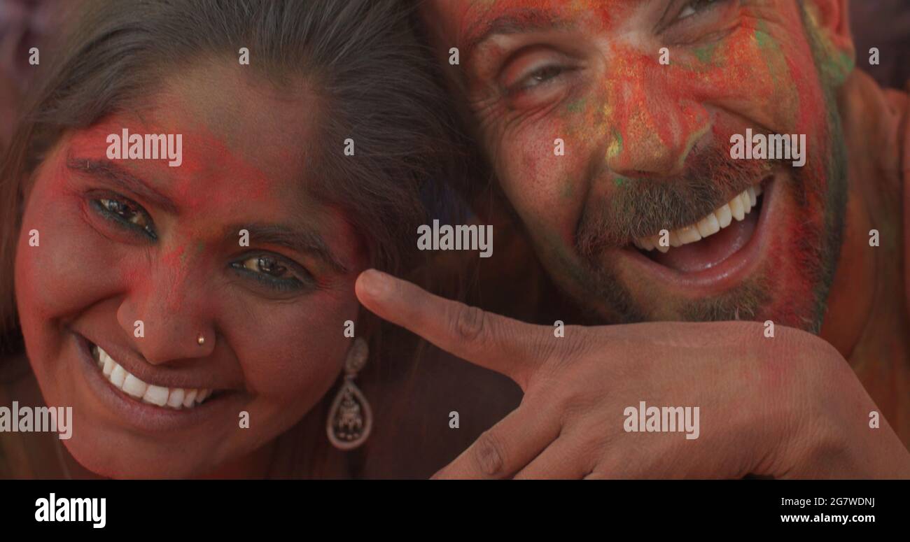 Smiling couple at the Holi Hindu festival of Color in India Stock Photo ...