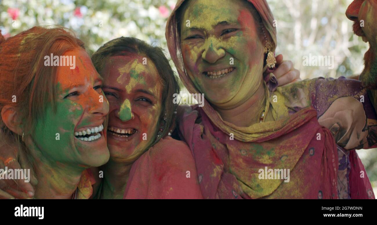 Group of people having fun at the Holi Hindu festival of Color in India ...