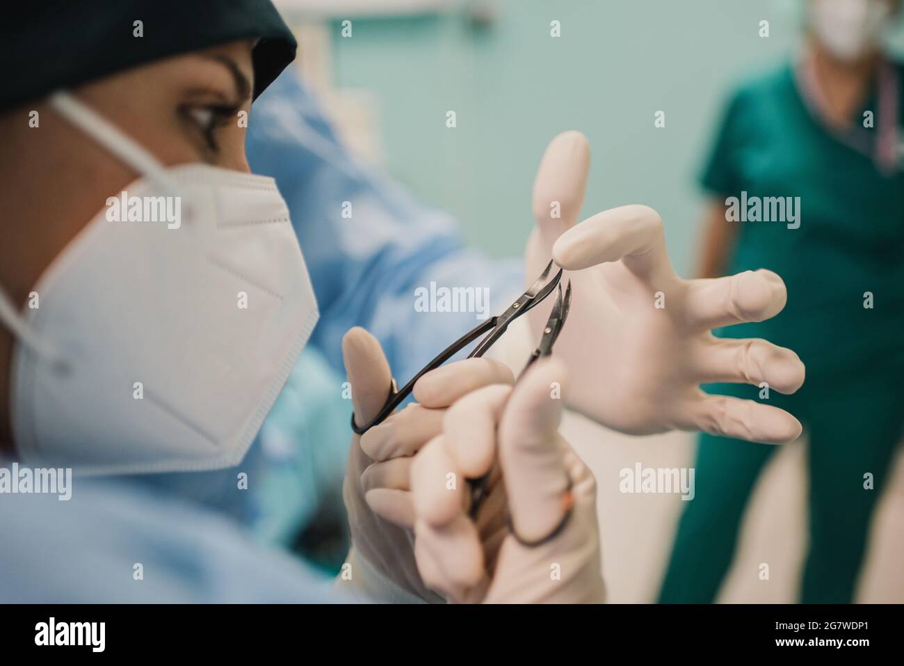 Female nurse preparing surgical equipment for operation inside hospital ...