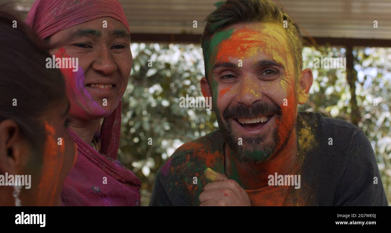 Group of people having fun at the Holi Hindu festival of Color in India ...