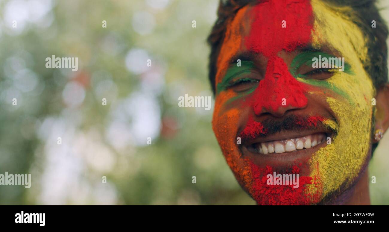 Male with a painted face at the Holi Hindu festival of Color in India ...
