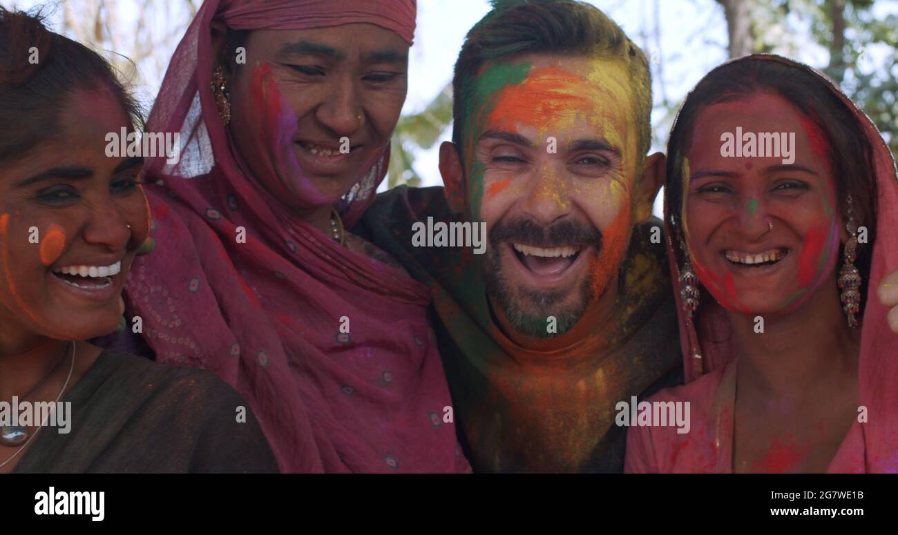 Group of people having fun at the Holi Hindu festival of Color in India ...